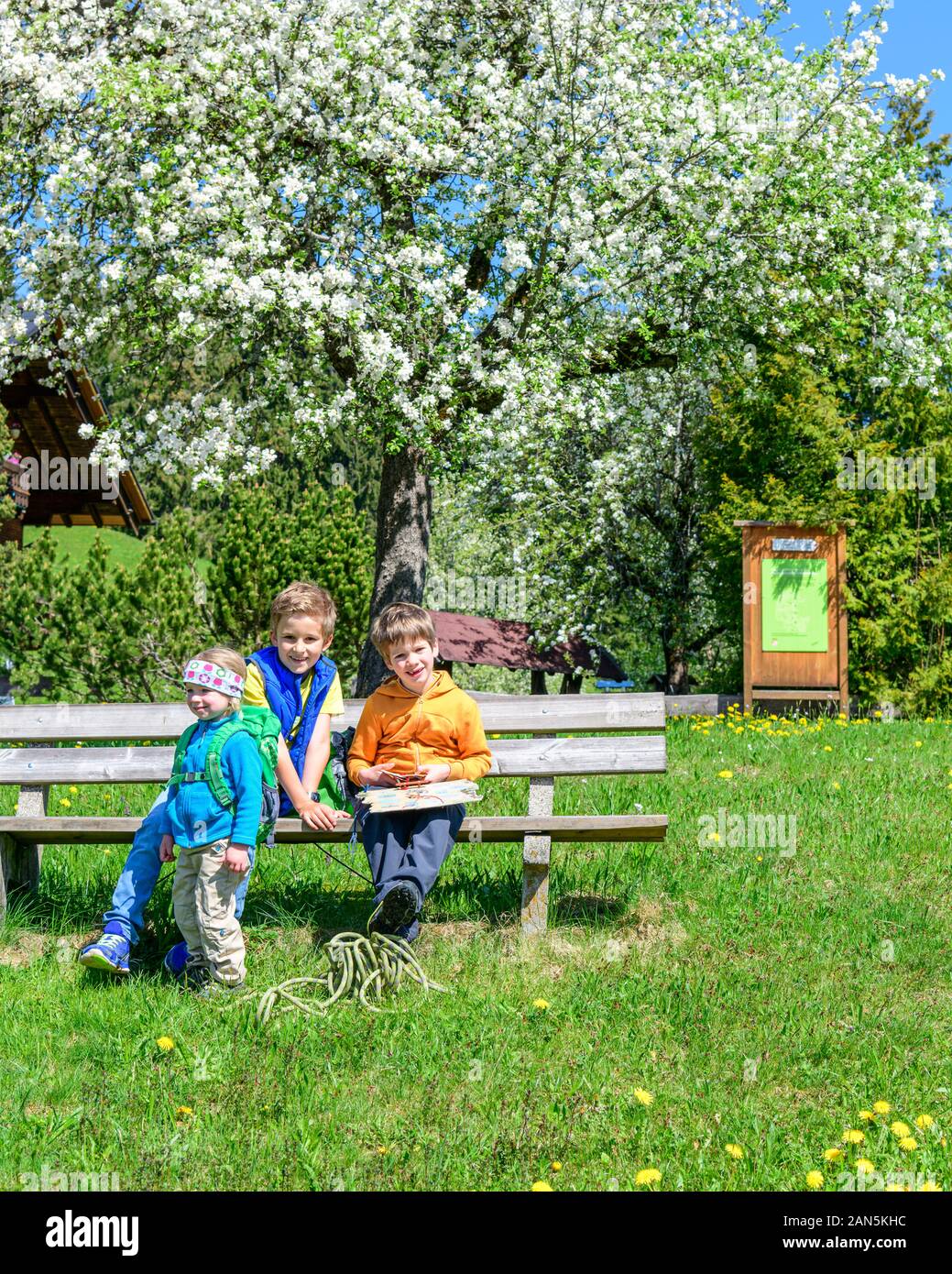 Family hiking tour in springtime nature on a nature adventure trail ...