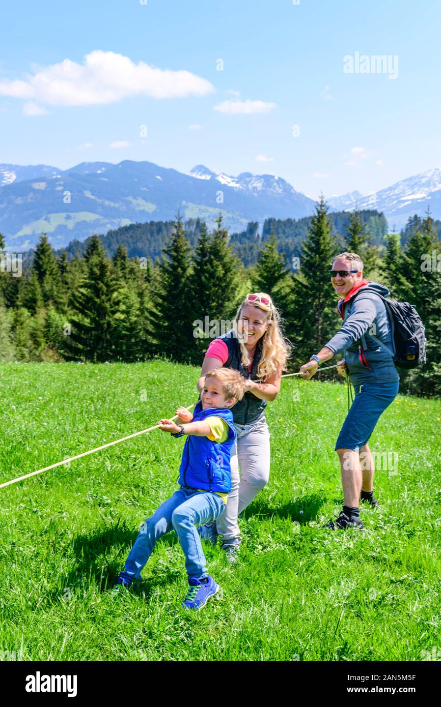 Family hiking tour in springtime nature on a nature adventure trail ...