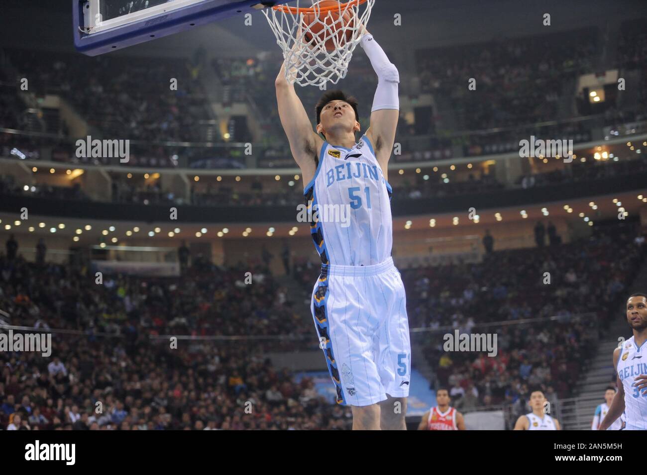 --FILE--Ji Zhe of Beijing Duck dunks during a CBA game against ...