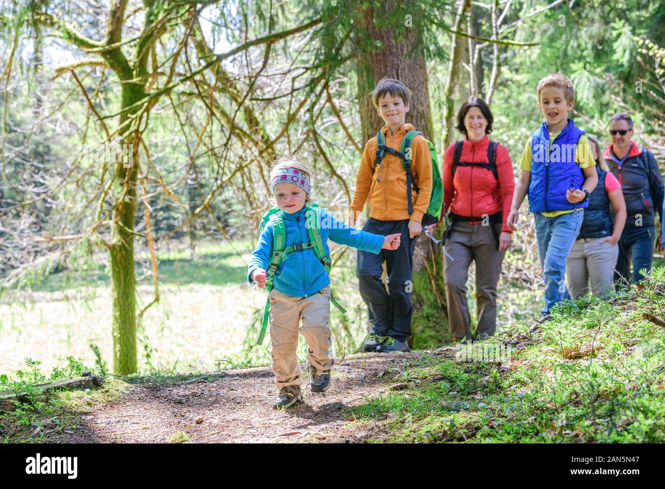 Family hiking tour in springtime nature on a nature adventure trail ...