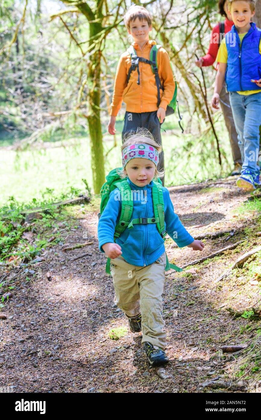 Family hiking tour in springtime nature on a nature adventure trail ...