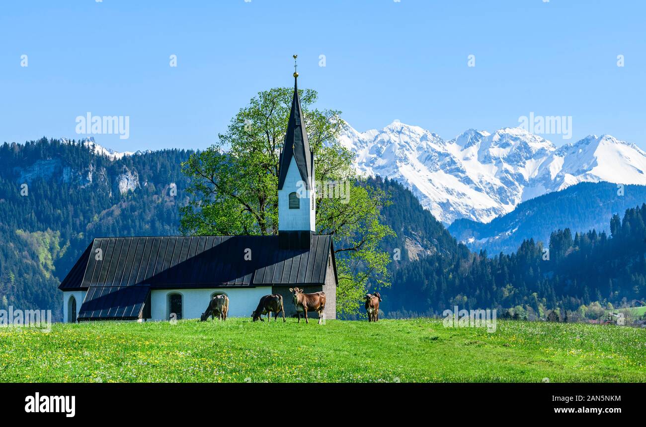 Church of Bolsterlang with a magnificent backdrop of the snow-covered ...