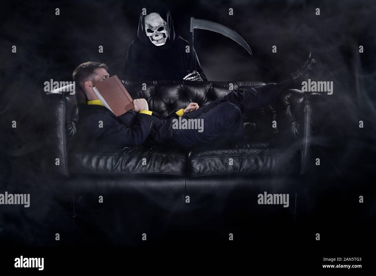 Man laying asleep on a couch with a book and being haunted by a ghost ...
