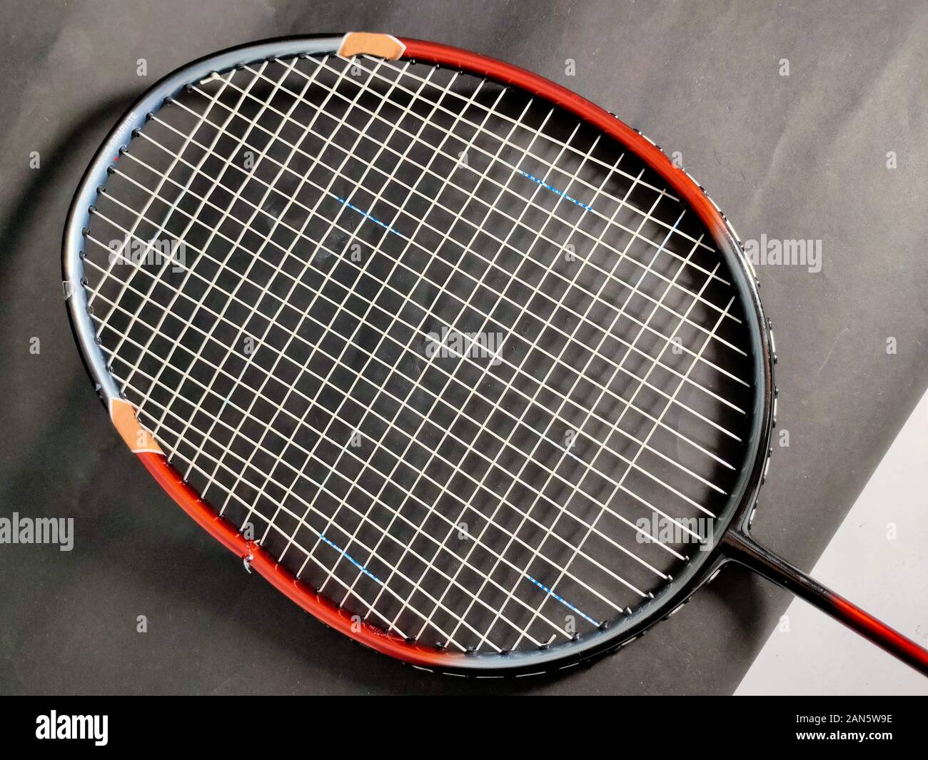 A Broken badminton racket on black background Stock Photo - Alamy