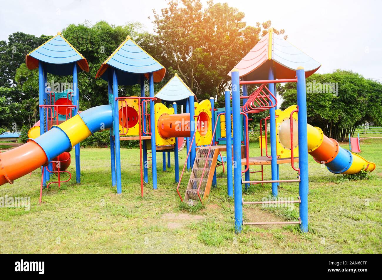 Children playground on outdoors activities in the garden with green ...