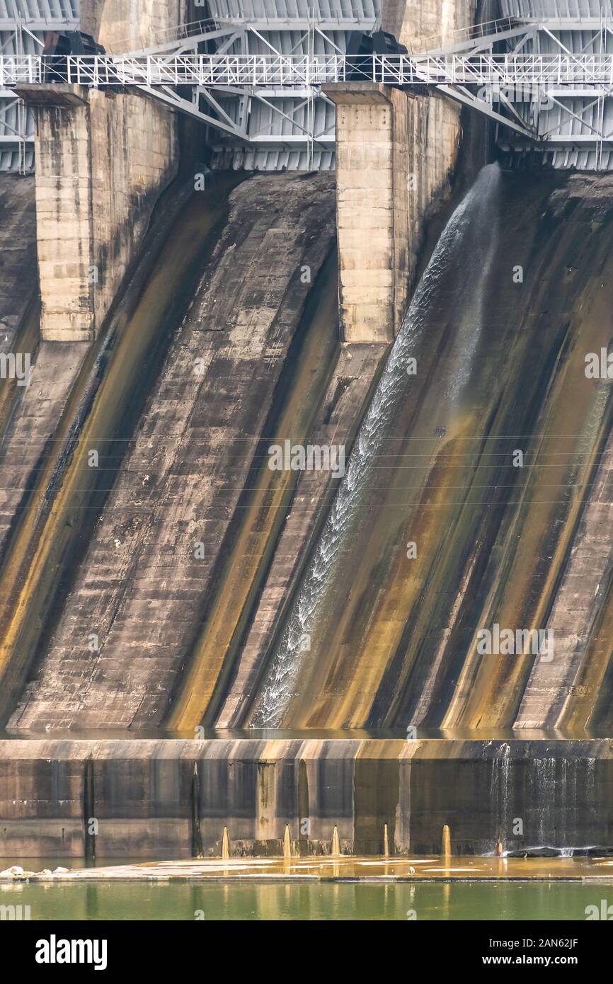 Water trickling through a water dam gate - closeup view of an hydro ...