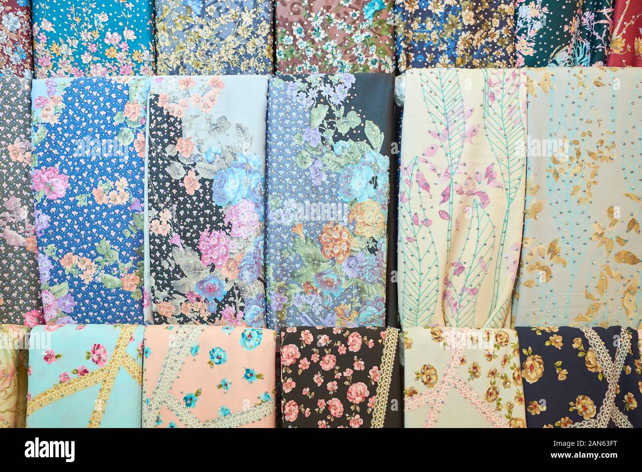 A display of colorful, traditional Malay floral design fabric, textiles ...