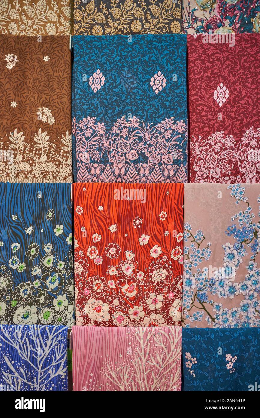 A display of colorful, traditional Malay floral design fabric, textiles ...