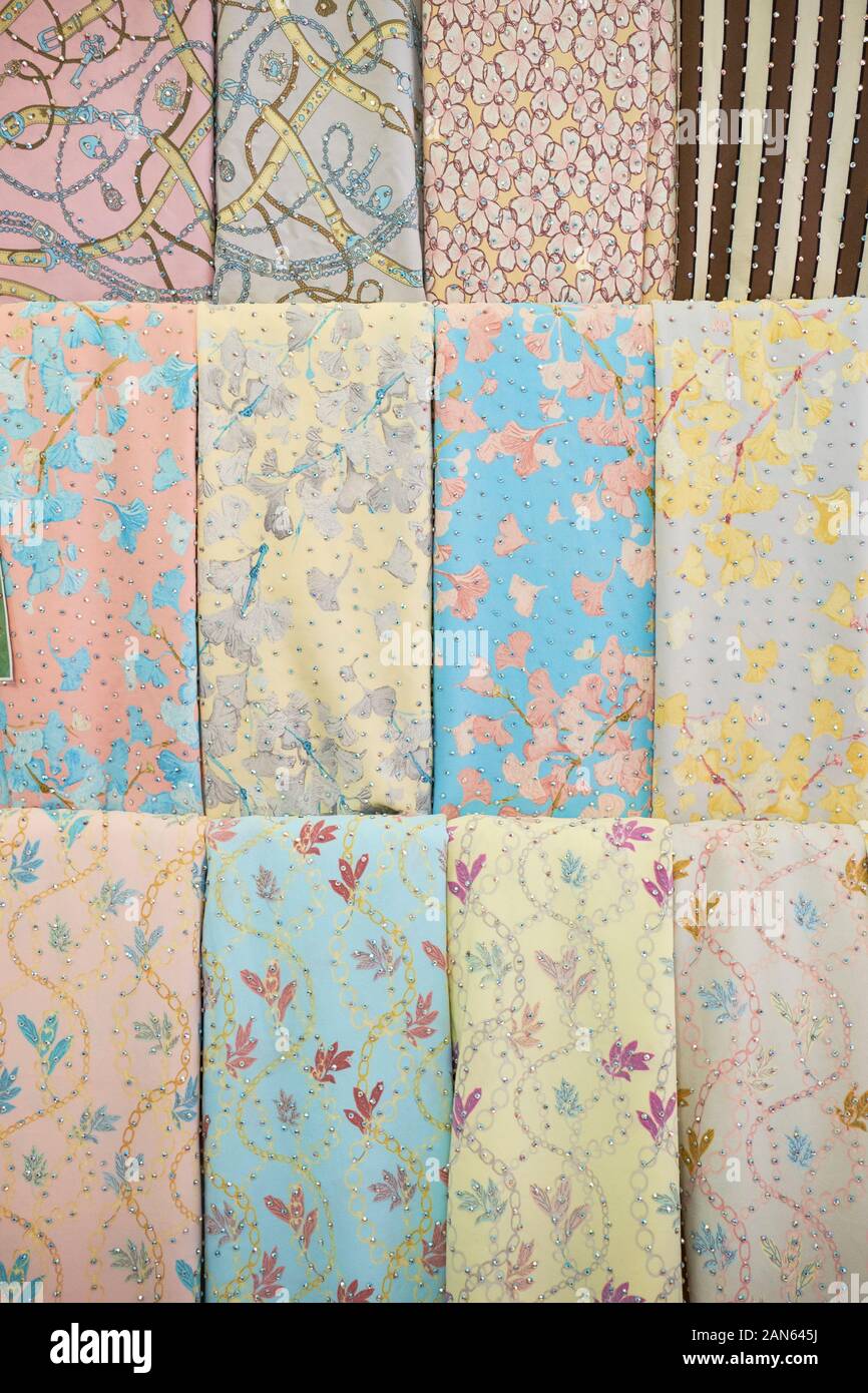 A display of colorful, traditional Malay floral design fabric, textiles ...
