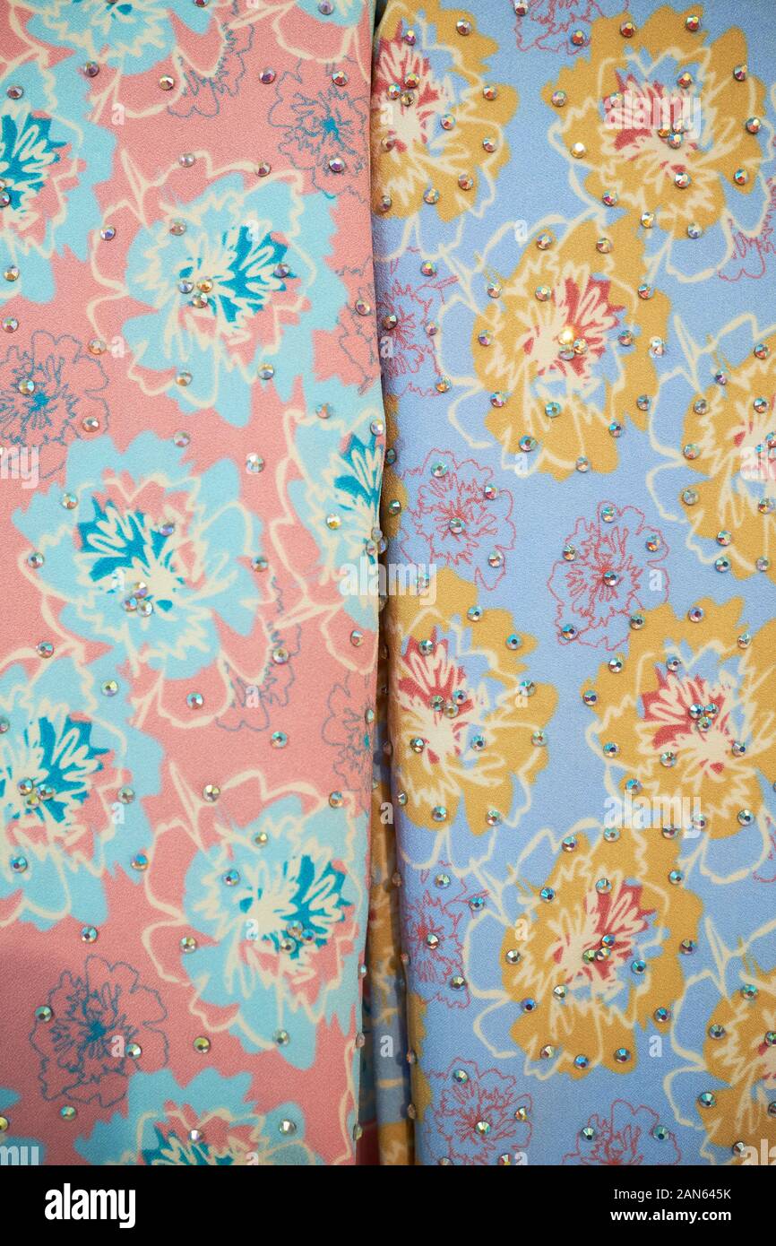 A display of colorful, traditional Malay floral design fabric, textiles ...