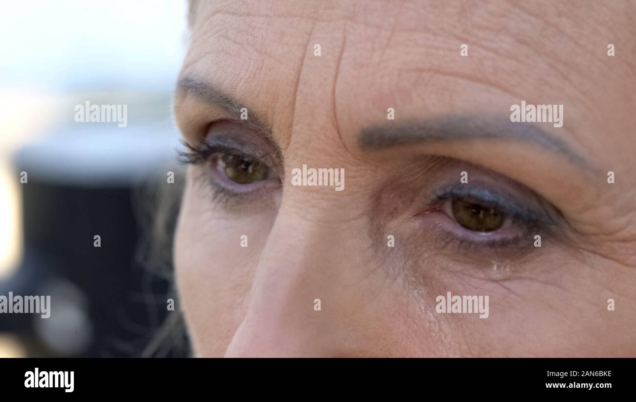 Senior woman crying, praying for peace, war victim, depression and ...