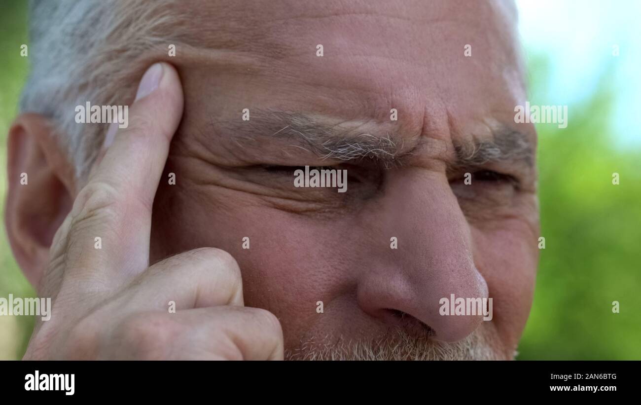 Senior man suffering eyesight problems, cataract disease, vision ...