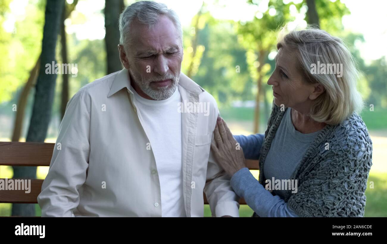 Senior man feeling unwell, dizziness and weakness, scared wife supports ...