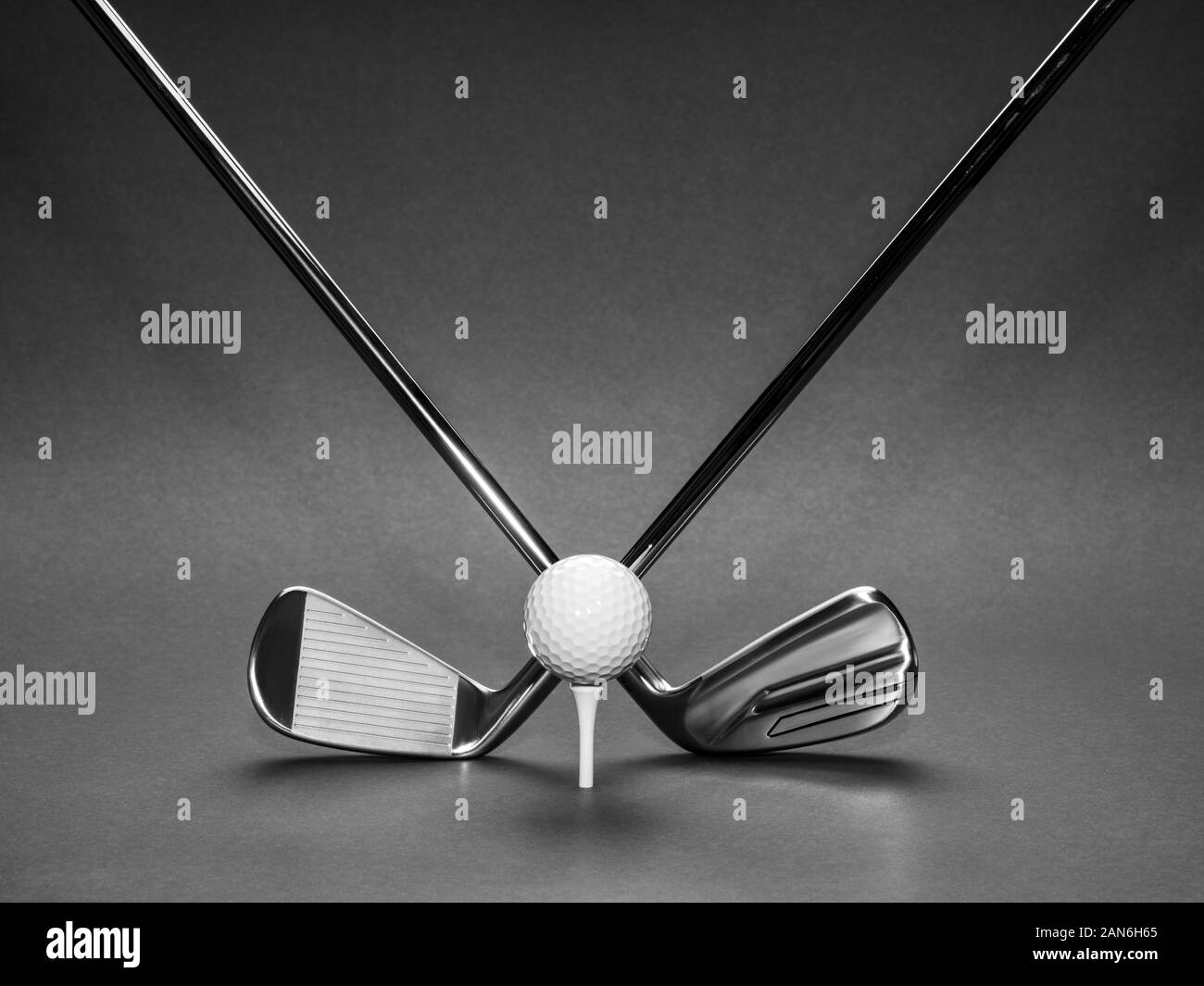 Two crossed golf clubs and golf ball in the middle Stock Photo - Alamy