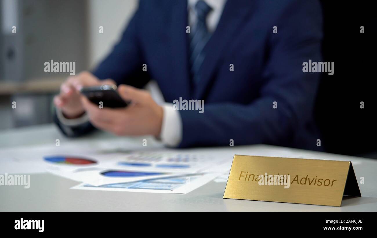 Professional financial advisor using smartphone, checking investment ...