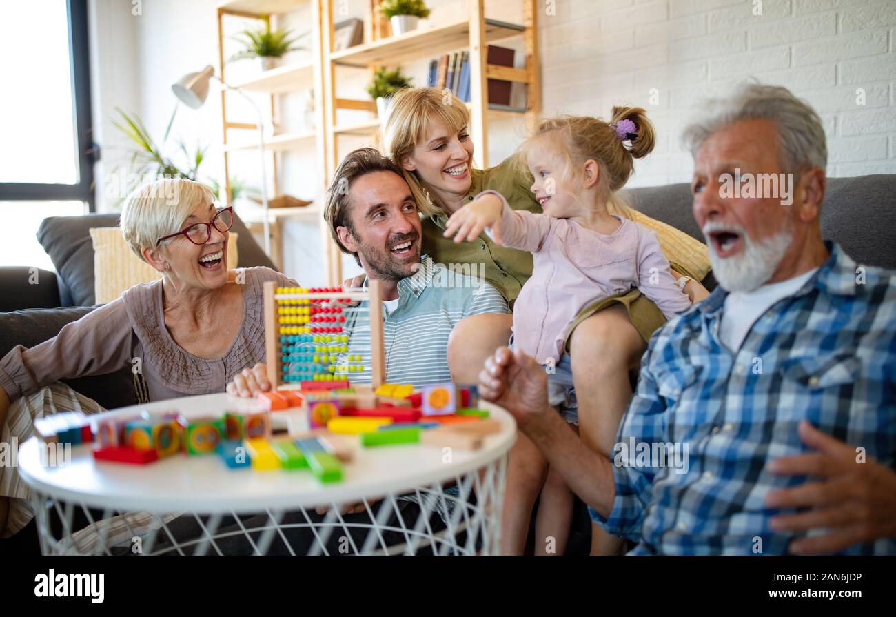 Senior grandparents playing with grandchildren and having fun with ...