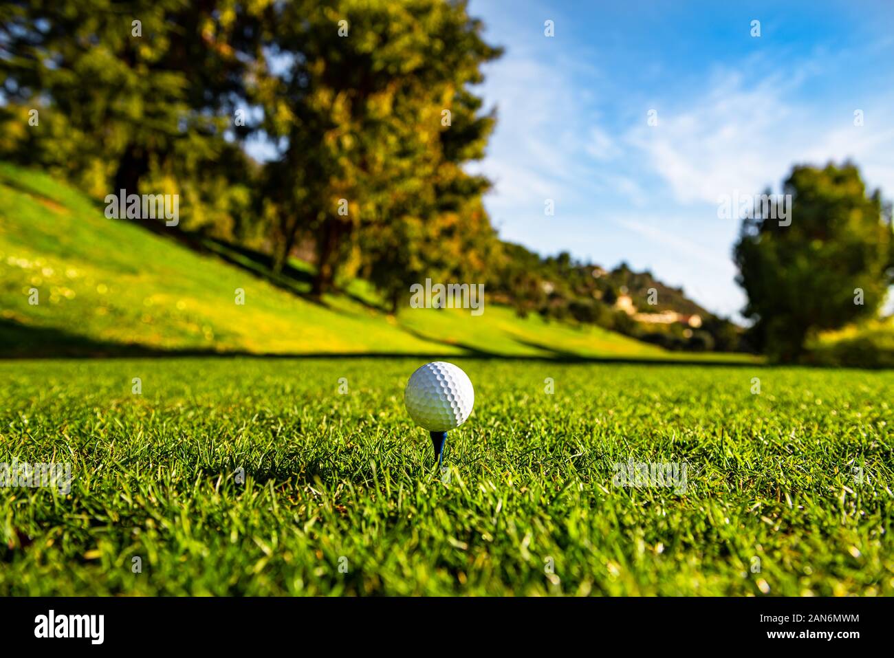 Golf ball on the starting tee in a golf course Stock Photo - Alamy