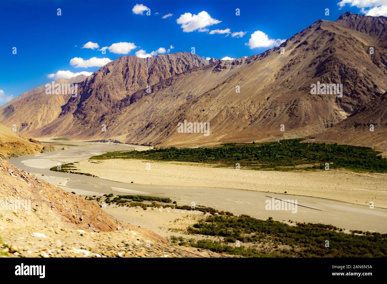 green sub himalayan vegetation below High dynamic range image of barren ...