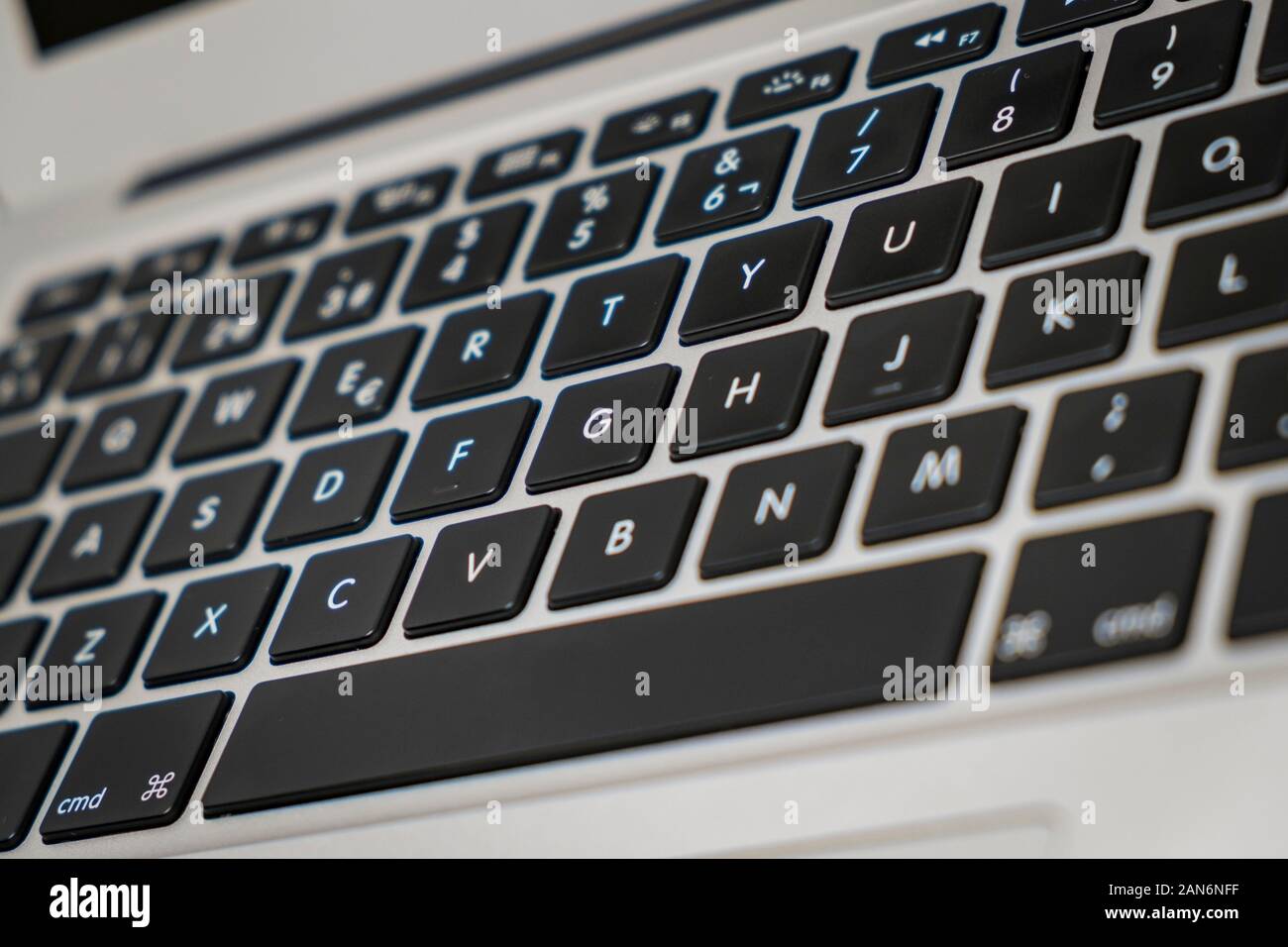 Detail of keyboard of a silver metal laptop Stock Photo - Alamy