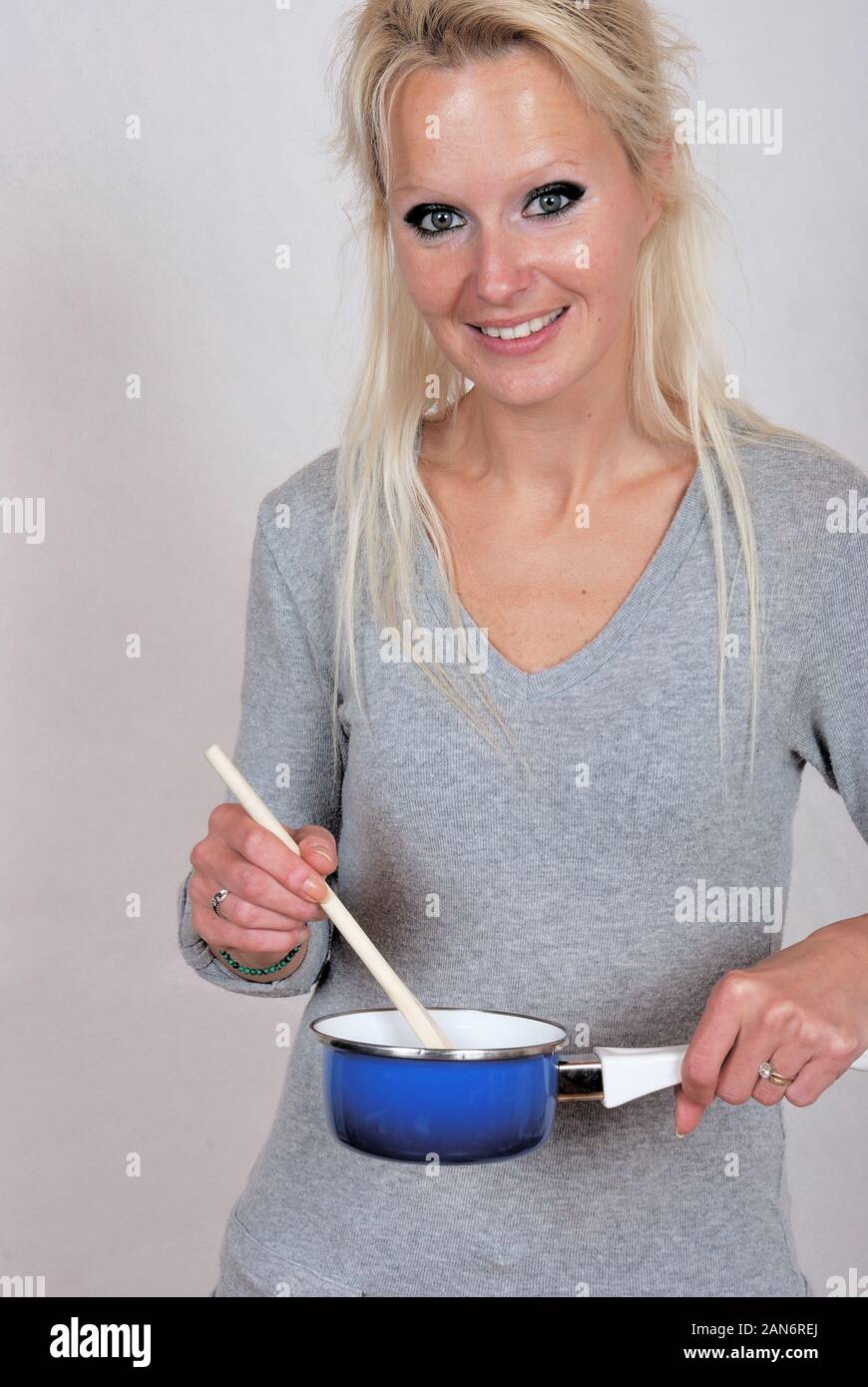 Woman with a pan Stock Photo - Alamy