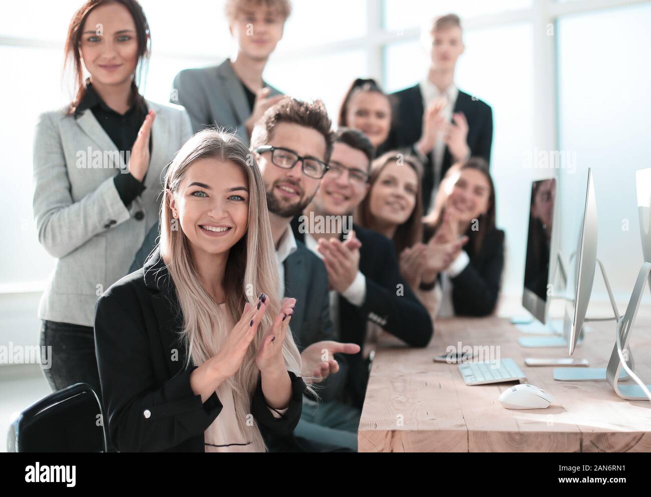 happy group of young professionals applauding their success Stock Photo ...