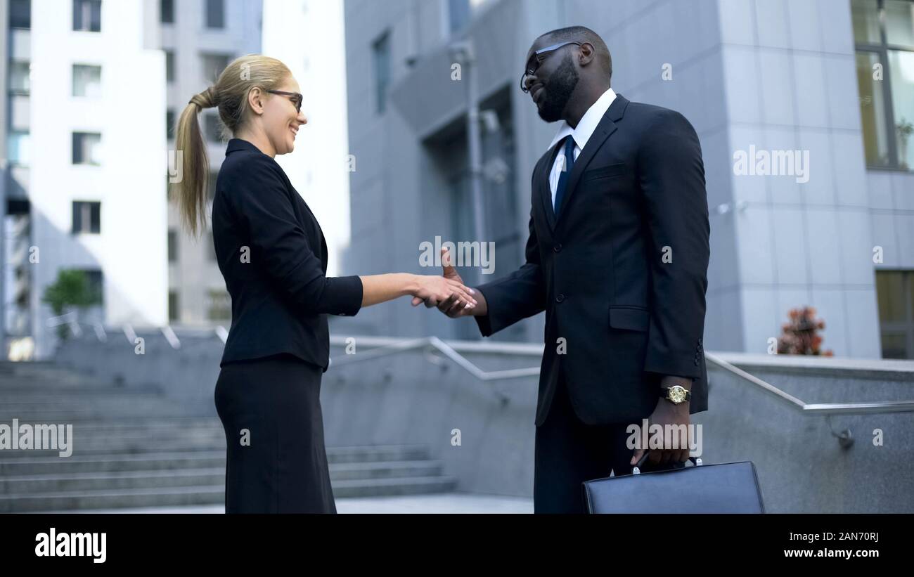 Business people shaking hands, collaboration and partnership, getting ...