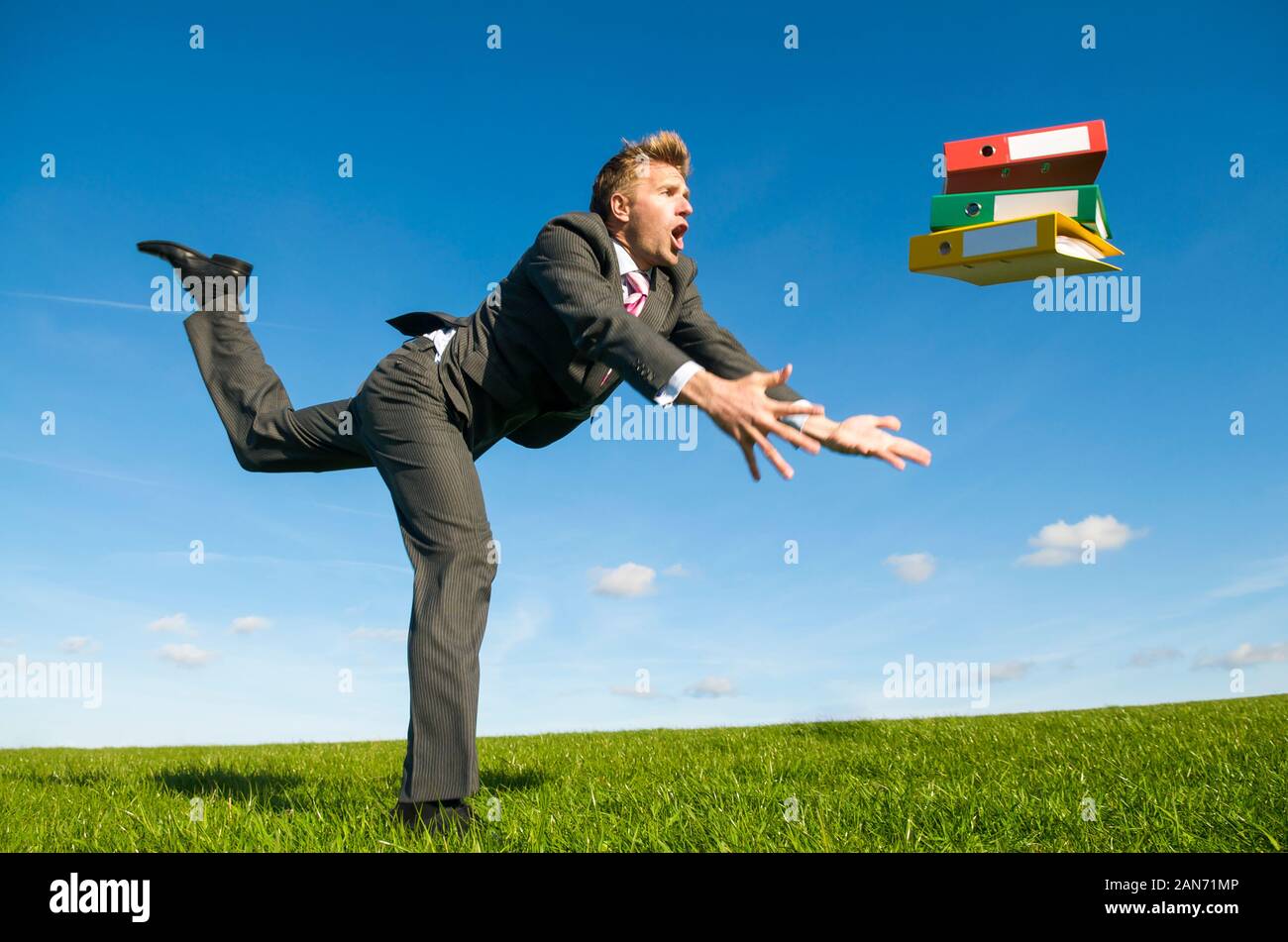 Clumsy businessman tripping dramatically with his file folders flying ...