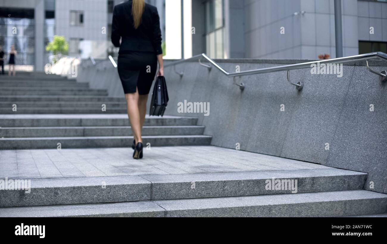 Business woman going upstairs hi-res stock photography and images - Alamy