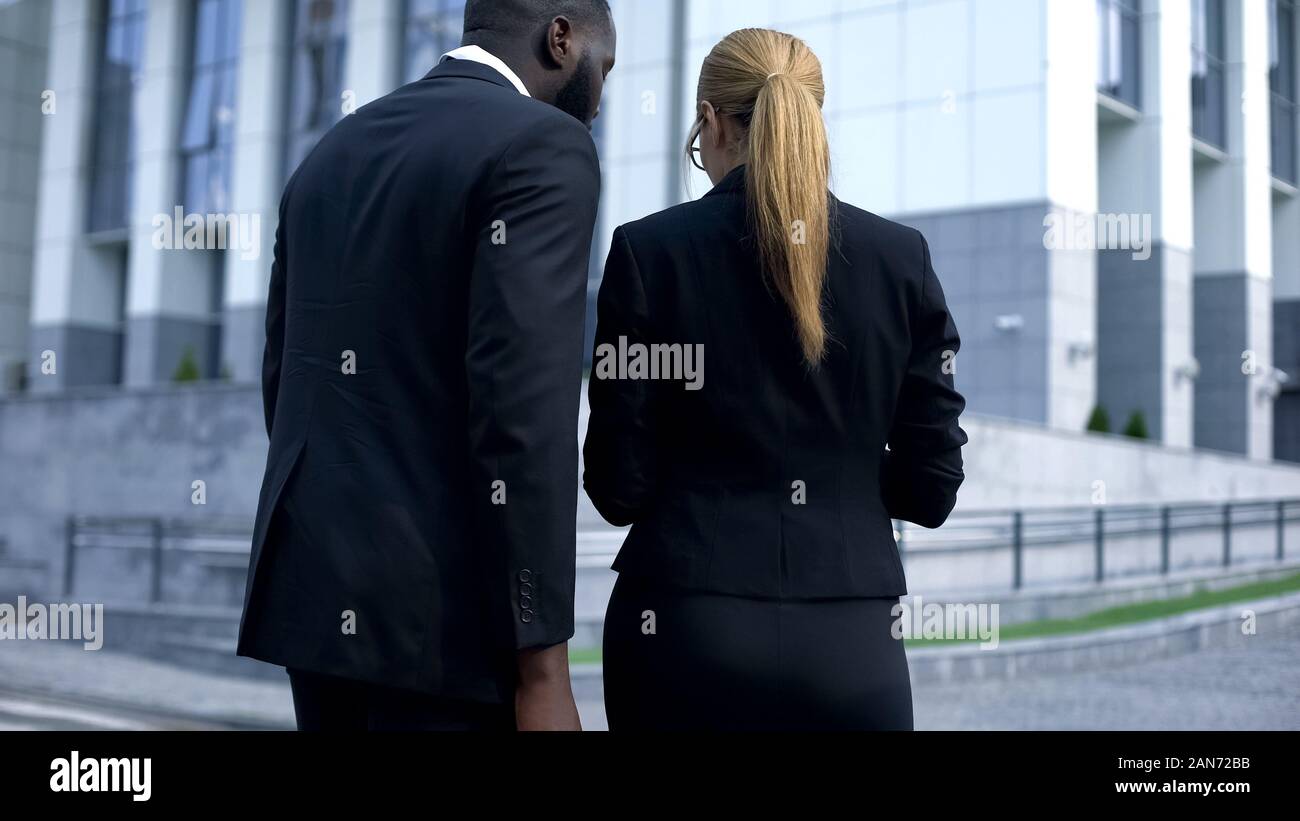 Business people reading documents, preparing speech before meeting ...