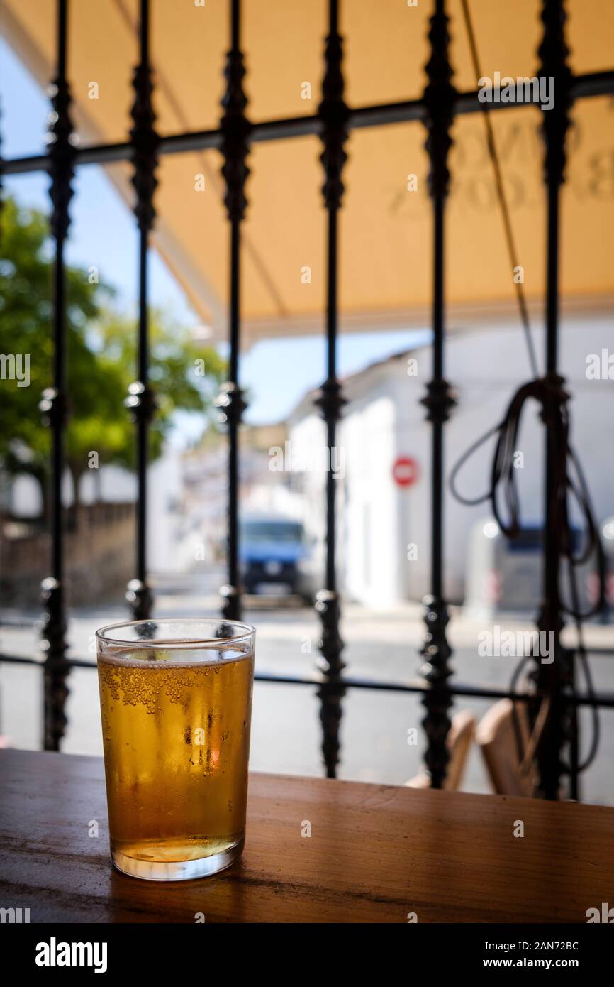 Refreshing glass of cold beer by the window ledge in a Mediterranean ...