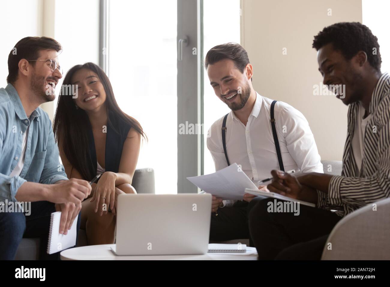 Diverse colleagues in office smiling hi-res stock photography and ...