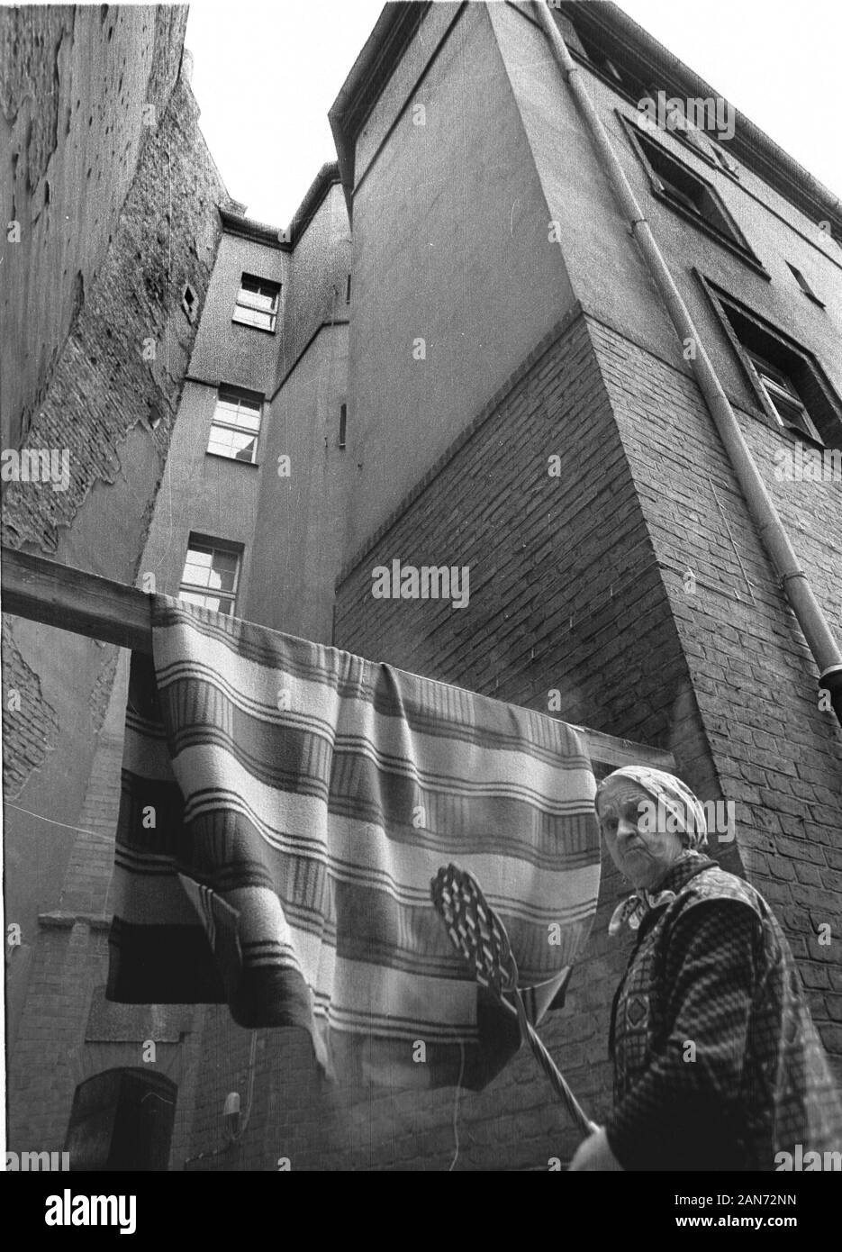 Carpet beating hi-res stock photography and images - Alamy