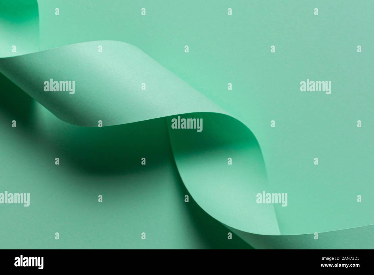 Abstract geometric shape green color paper background Stock Photo - Alamy