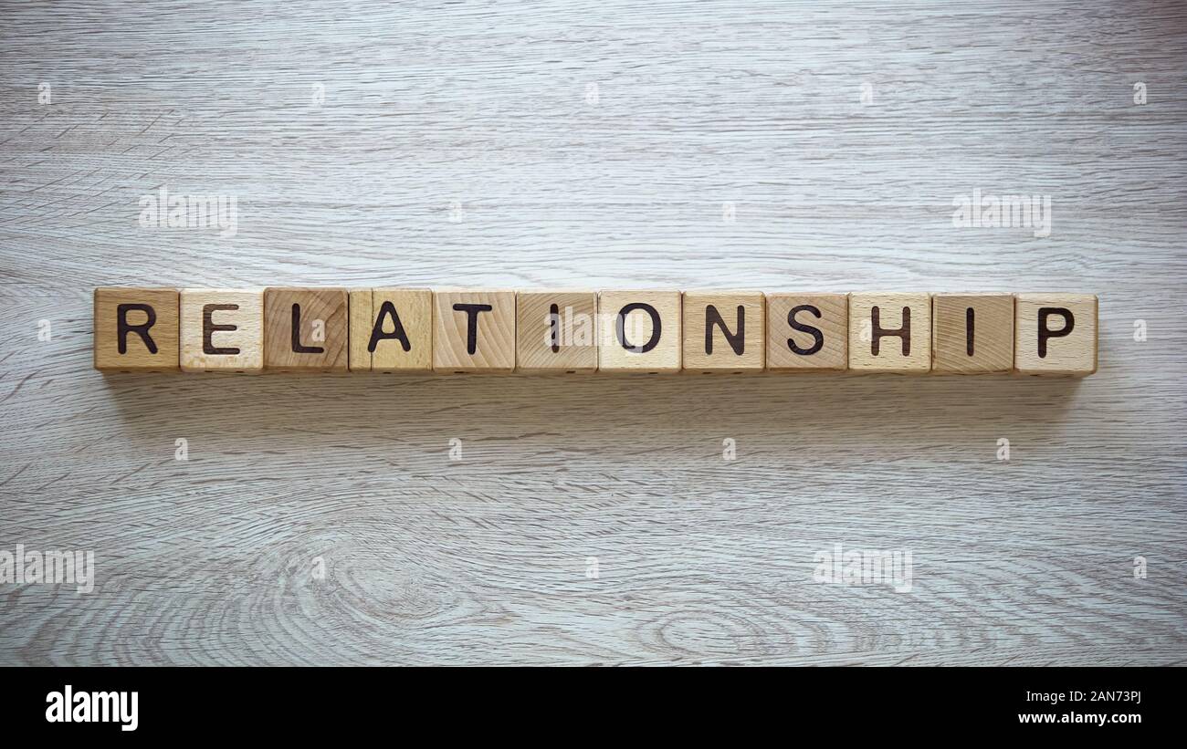 Relationship word made of cubes, family planning, man and woman ...