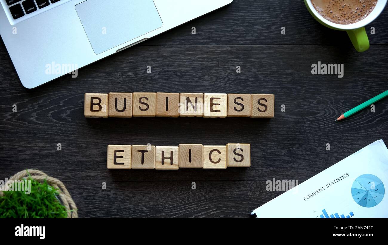 Business ethics phrase made of wooden cubes, behavior rules in company ...