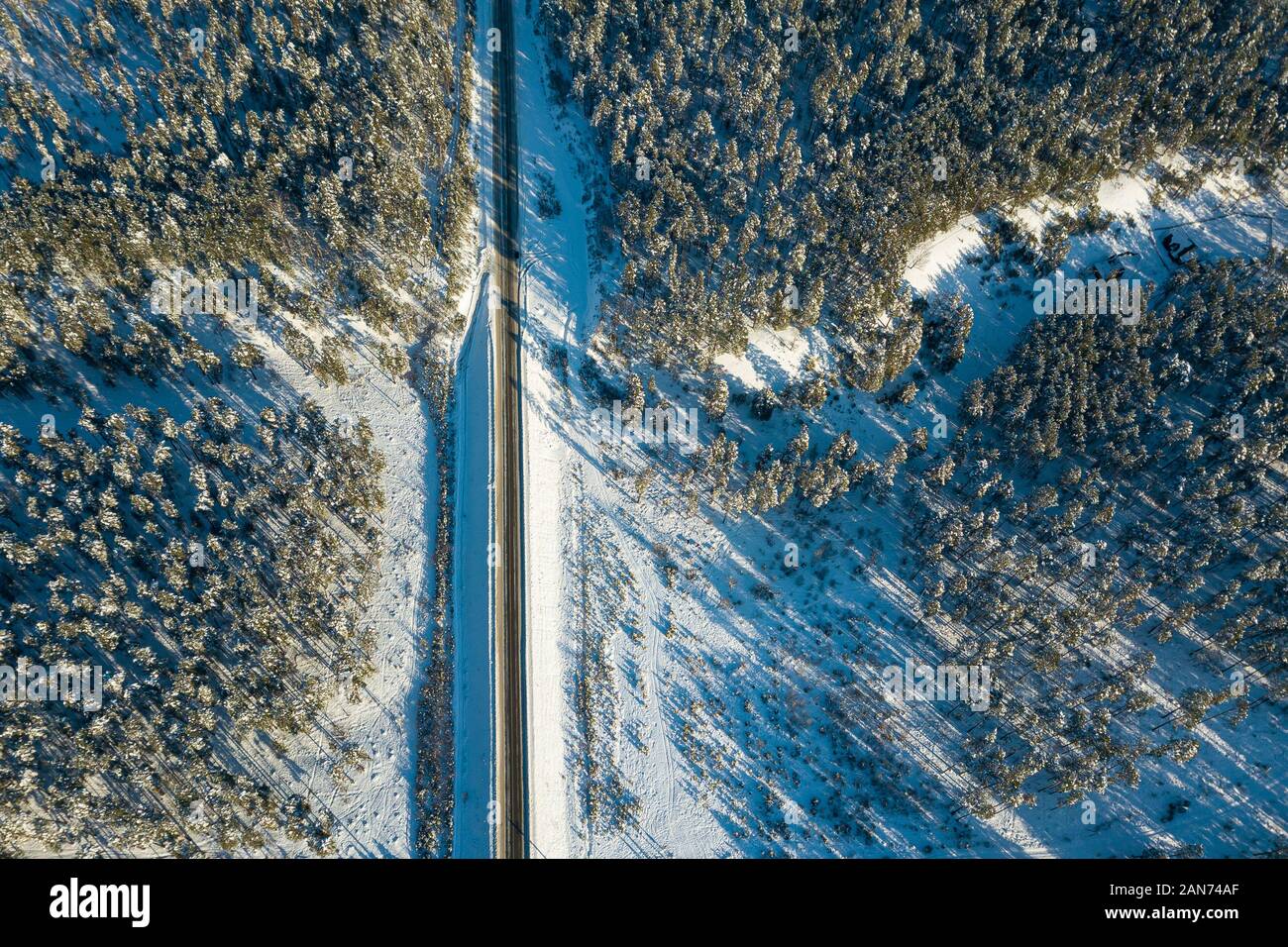Aerial view of a direct asphalt road vertically in the mountains with ...