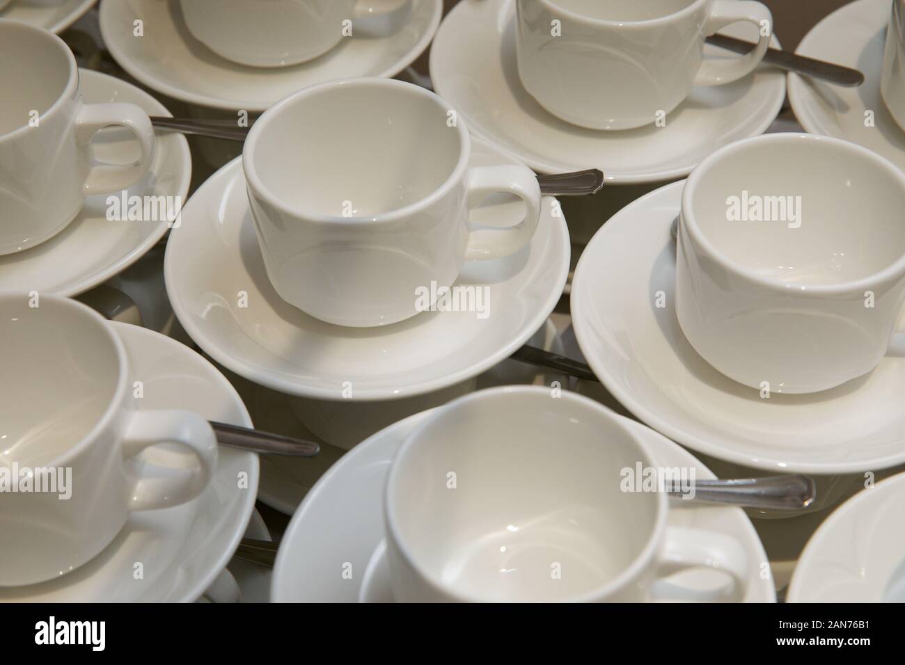 A collection of stacked empty cups and saucers ready for service Stock ...
