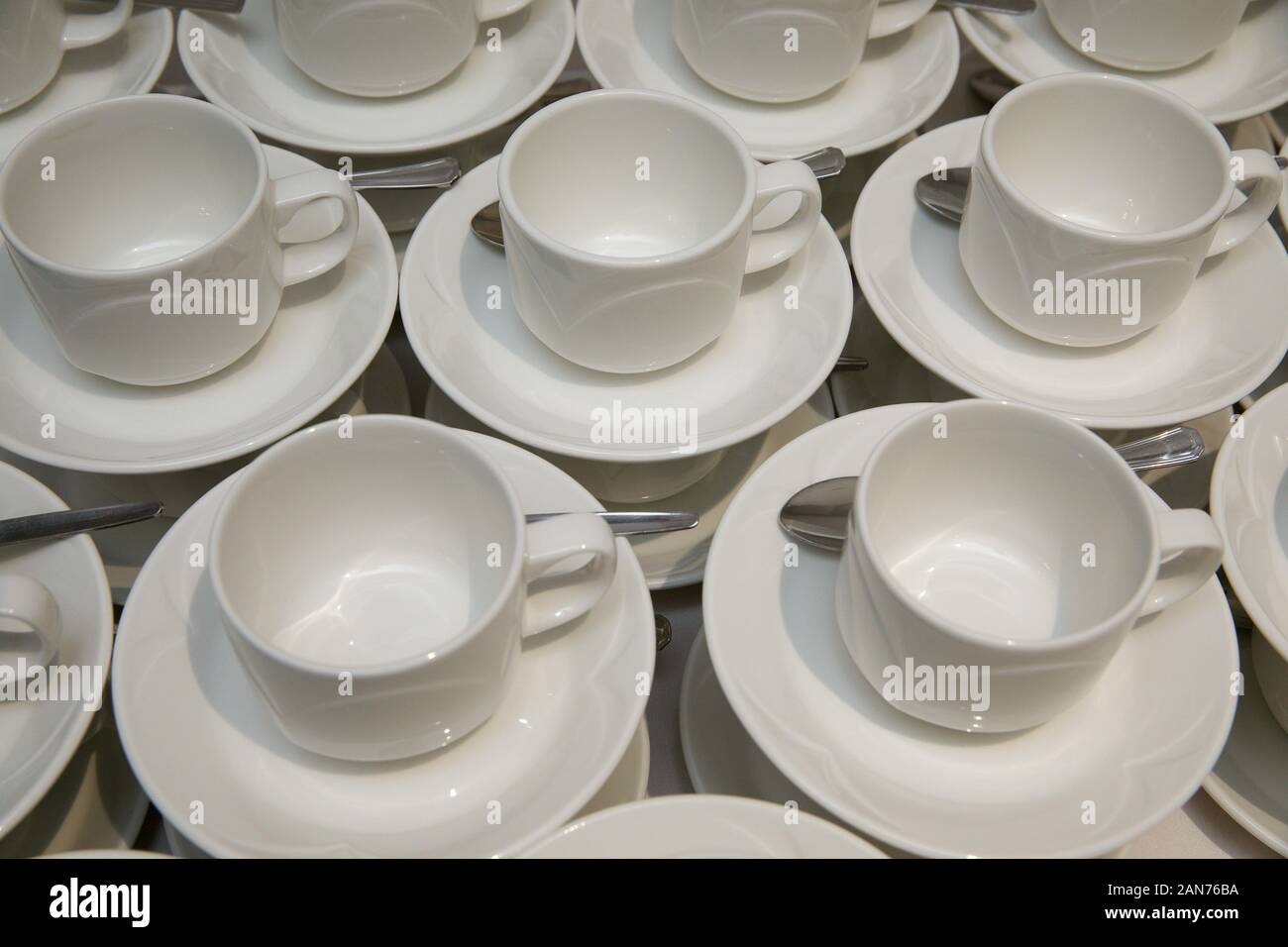 A collection of stacked empty cups and saucers ready for service Stock ...