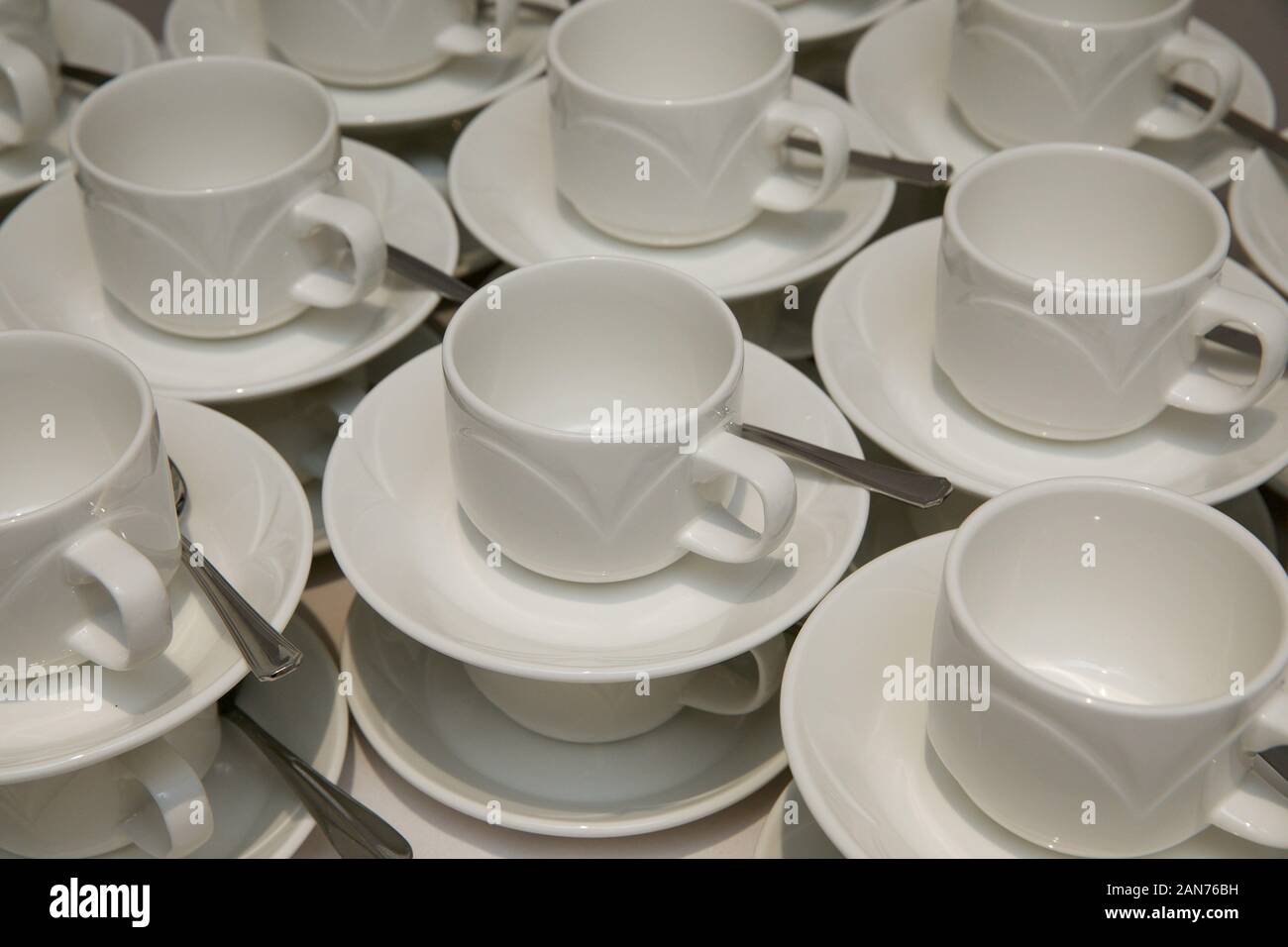 A collection of stacked empty cups and saucers ready for service Stock ...