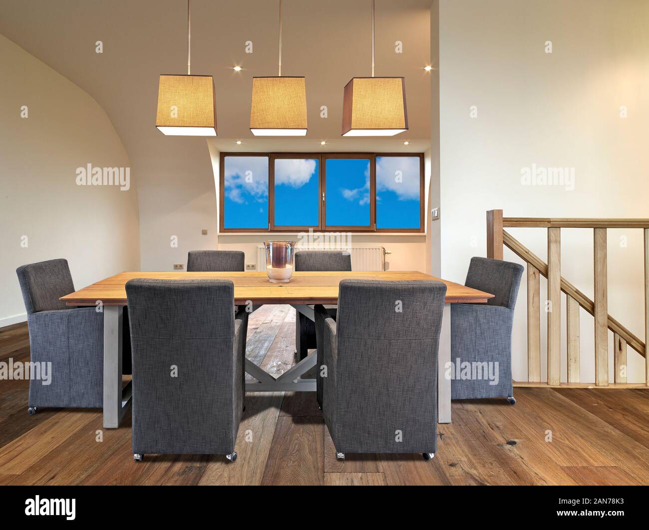 Modern interior with Dining table from front Stock Photo - Alamy