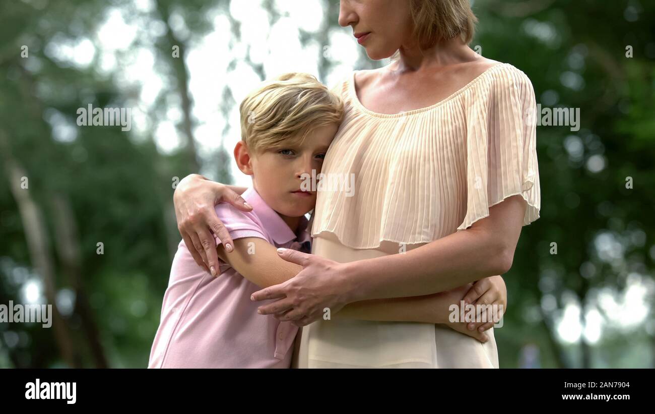 Boy hugging mother hi-res stock photography and images - Alamy