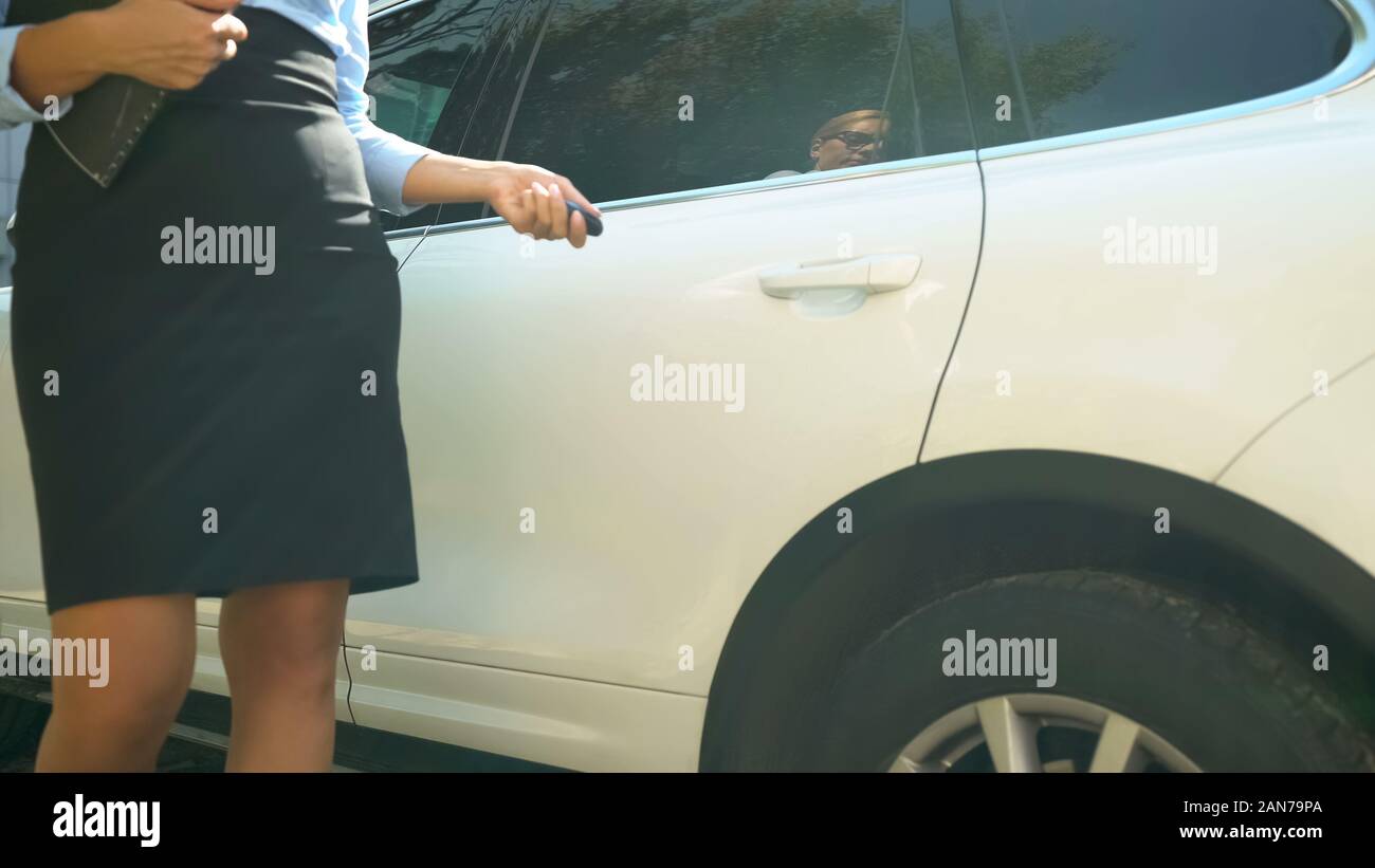 Woman turning on signaling on her luxury automobile successful career ...