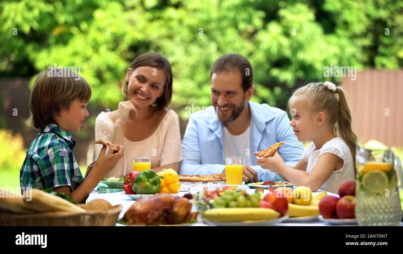 Kids eating pizza at home hi-res stock photography and images - Alamy