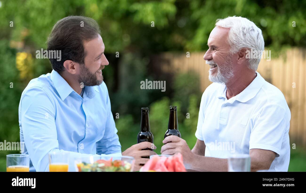 Father son cheers hi-res stock photography and images - Alamy