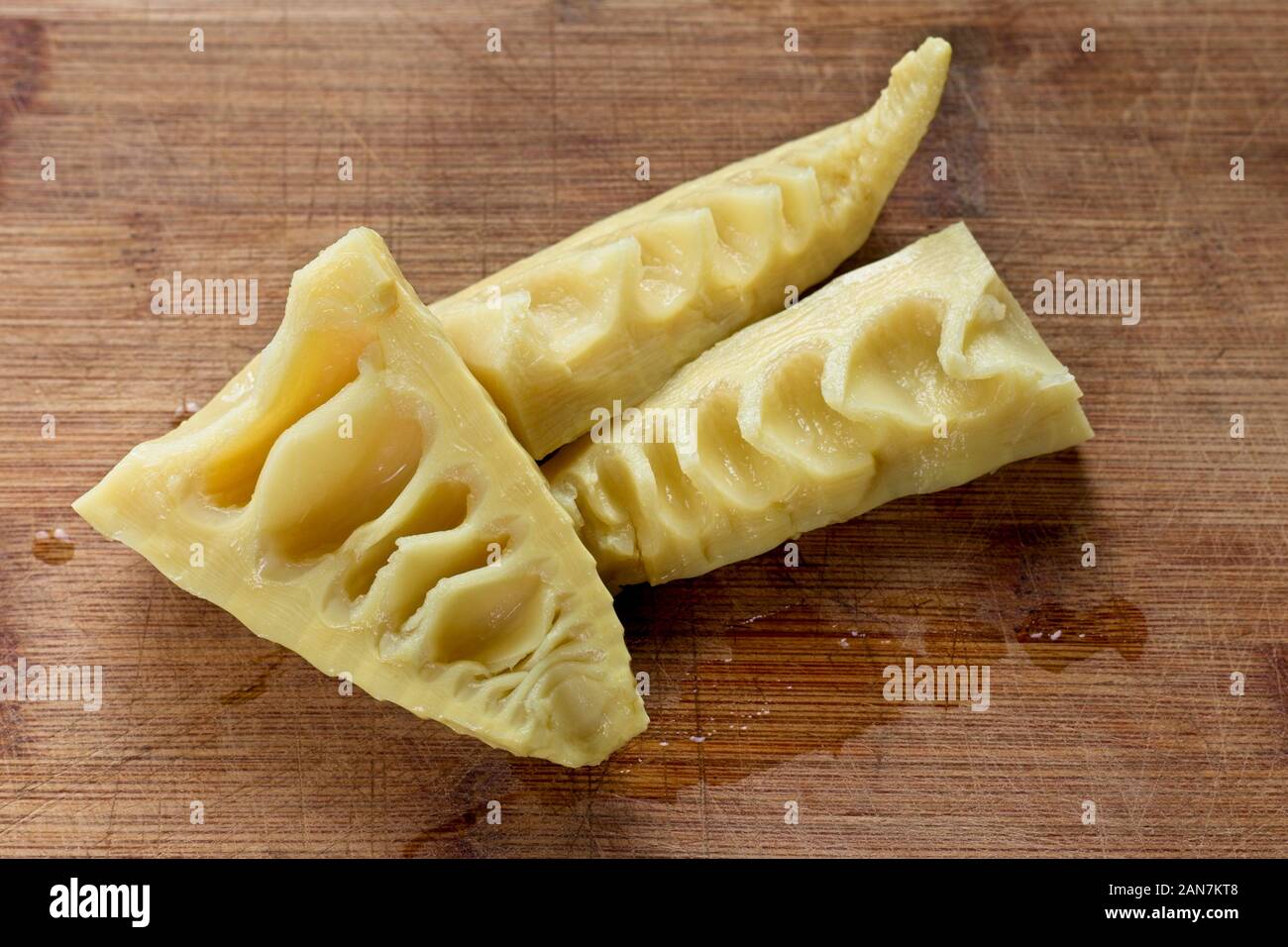 Edible bamboo shoots on a wooden chopping board Stock Photo - Alamy