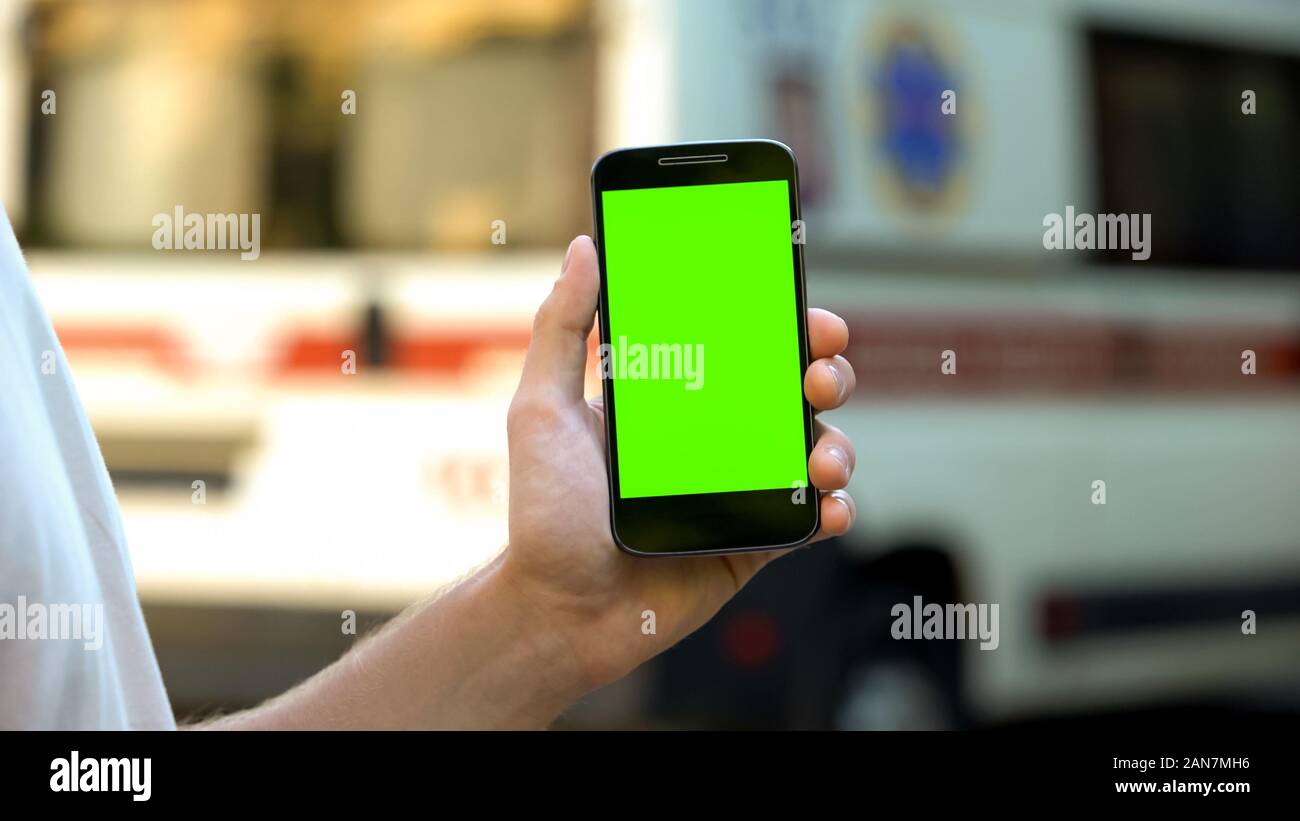 Male holding cell phone ambulance hi-res stock photography and images ...