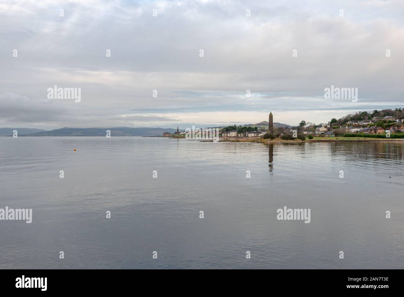 Largs foreshore looking past the Pencil Monument on a gloomy winters ...
