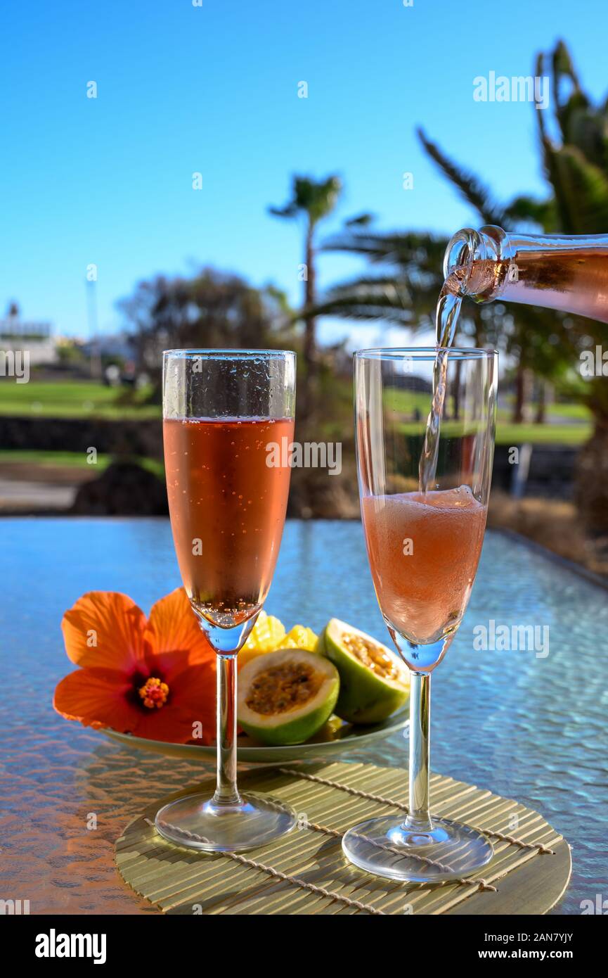 Two glasses of rose bubbles champagne or cava wine romantic served with ...