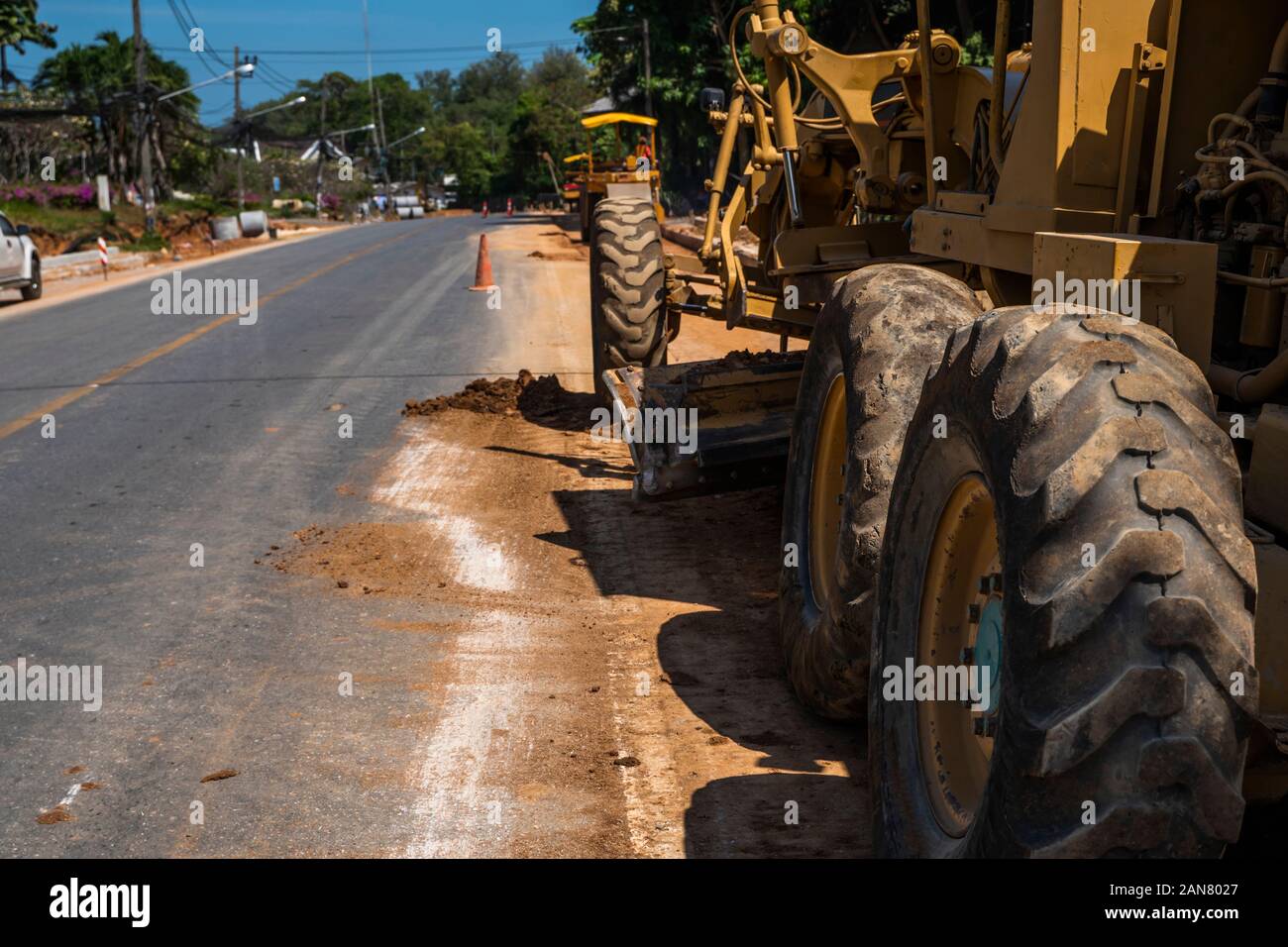 Details of grader is working on road construction. Grader industrial ...
