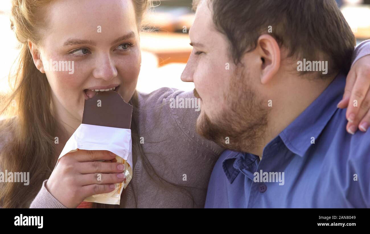 Man eating chocolate bar and happy hi-res stock photography and images ...